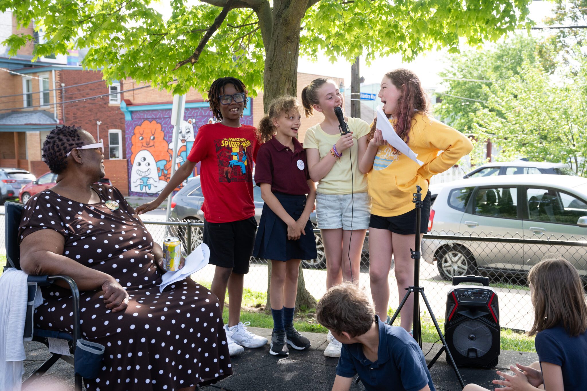 Students celebrate their words coming to life at Rain Poetry reveal in ...